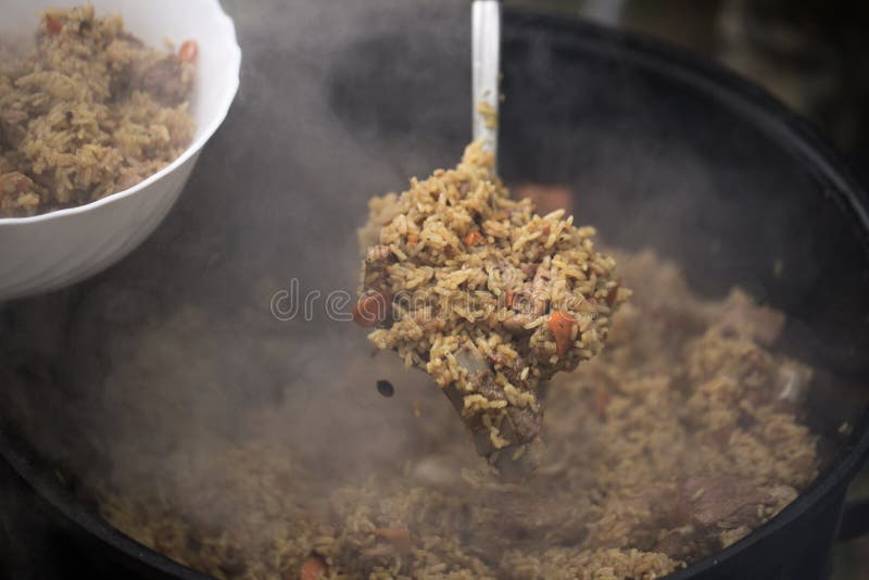Pilaf, cooked outdoors stock image. Image of meat, cuisine - 51194469