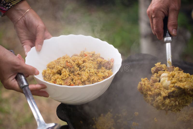 Pilaf, cooked outdoors stock image. Image of cooking - 51195617