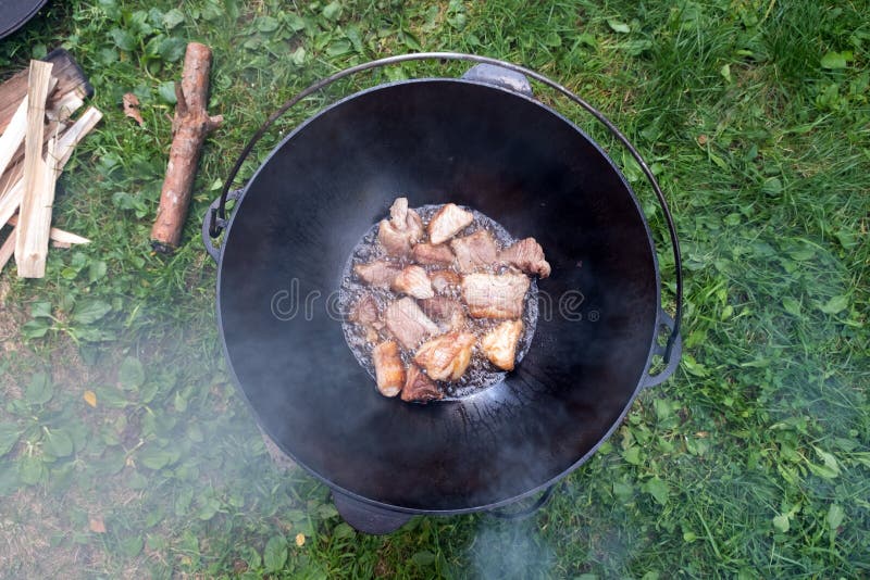 Pilaf. Cooking Step by Step. Step 1. Cooking Meat in a Cauldron. Pork ...