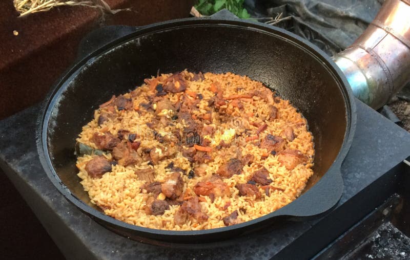 Pilaf in kazan on fire. stock image. Image of ethnic - 114389851