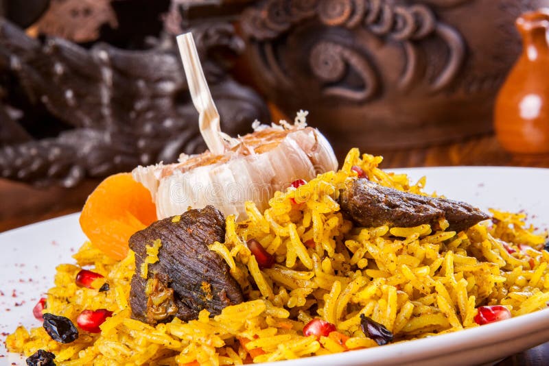 Traditional Uzbek Pilaf with Meat, Vegetables and Garlic. Top View ...