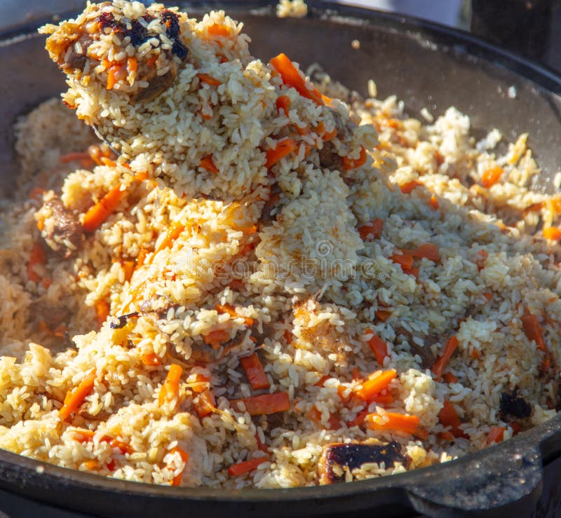 Pilaf with Rice is Cooked on a Cast-iron Cauldron Stock Image - Image ...