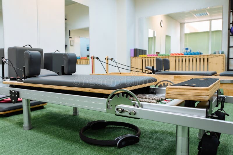 Pilates gym on reformer stock photo. Image of yoga, girl - 314810022