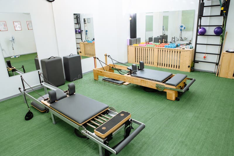 Pilates Reformer Exercise Machine Stock Photo - Image of pilates, girl ...