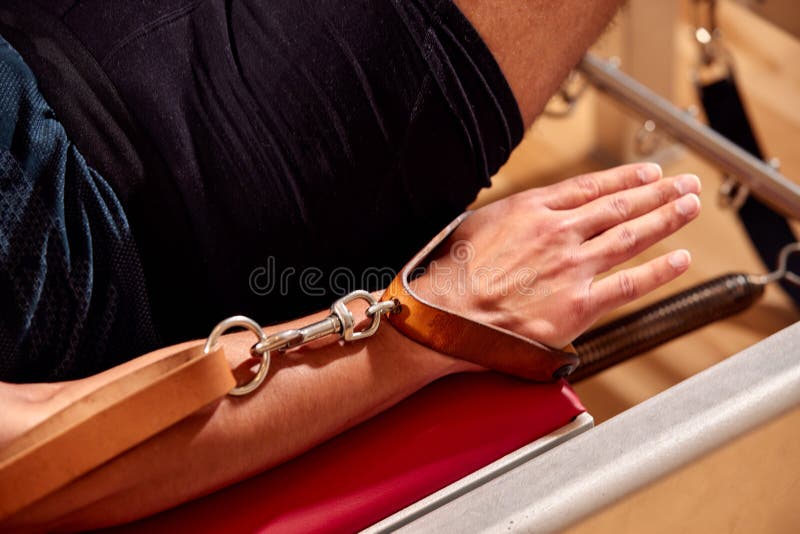Pilates Reformer Workout Exercises Man at Gym Indoor. Stock Photo ...