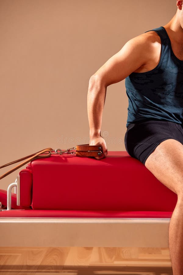 Pilates Reformer Workout Exercises Man at Gym Indoor. Stock Photo ...