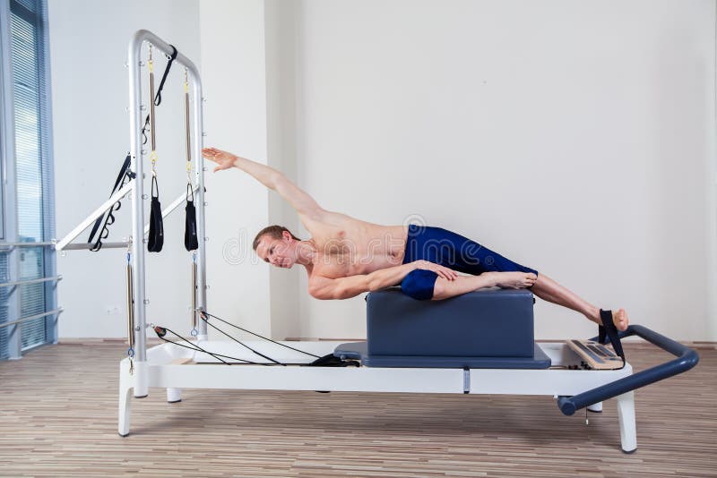 Pilates Reformer Workout Exercises Man at Gym Stock Photo - Image of ...