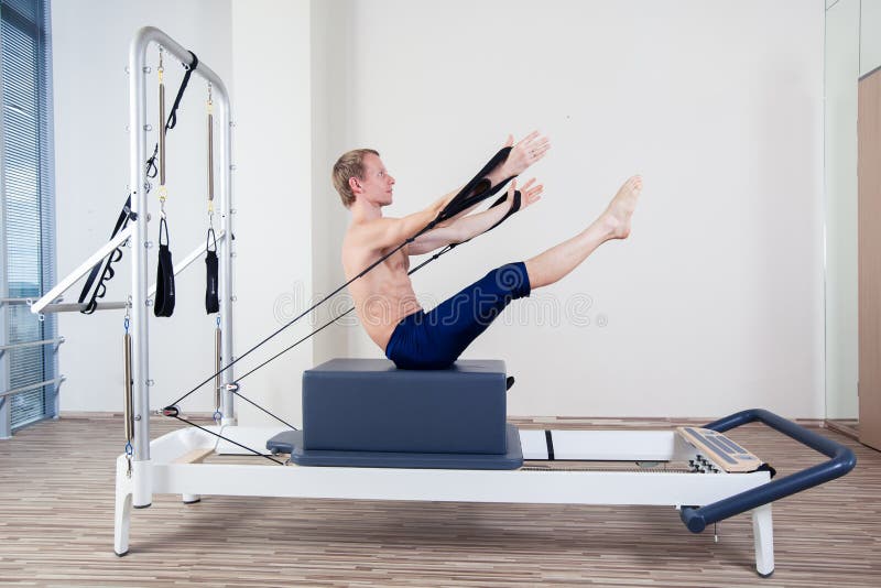 Pilates Reformer Workout Exercises Man at Gym Stock Photo - Image of ...