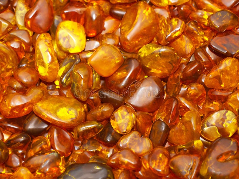 A Pile of Amber Stones with a Yellow Center Stock Image - Image of ...