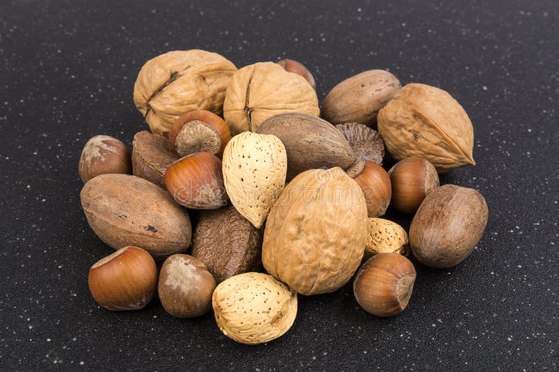 Pile of Assorted Nuts in the Shell Isolated Over Black Stock Image ...