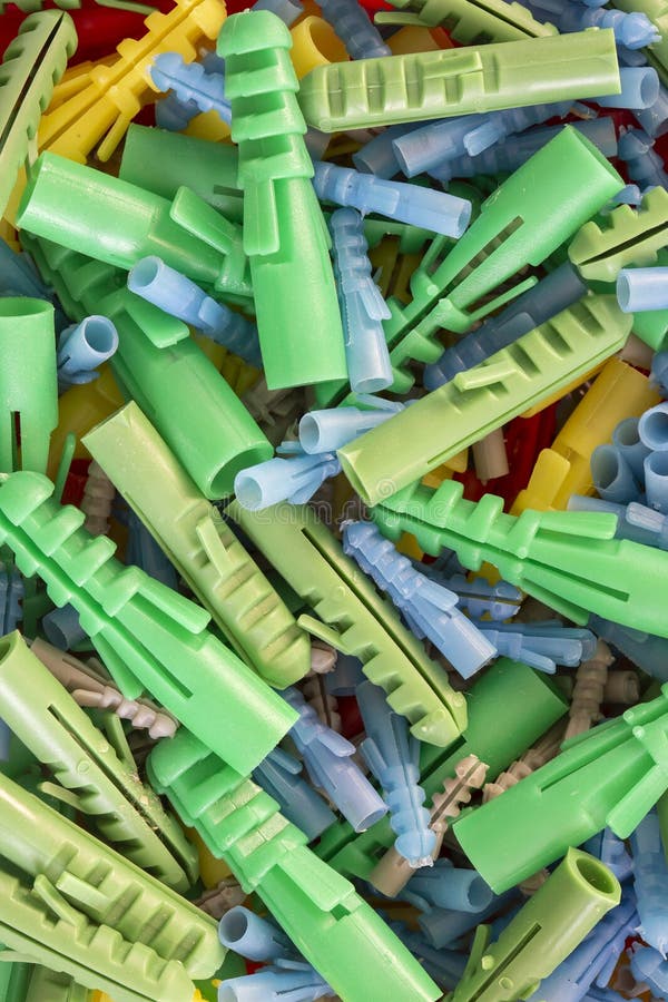 Pile of Assorted Sizes Wall Plugs Background. Construction Do it ...
