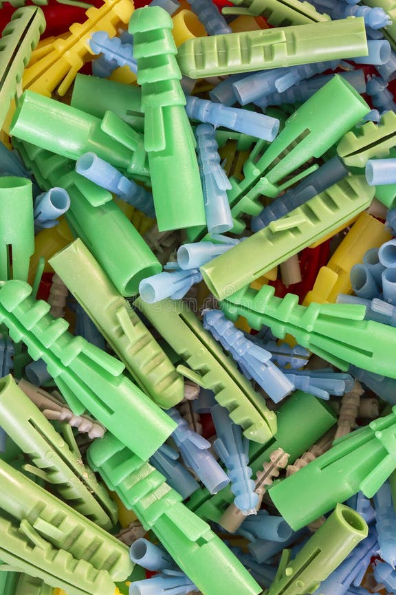 Pile of Assorted Sizes Wall Plugs Background. Construction Do it ...