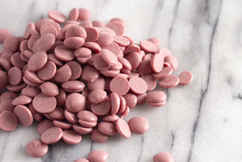 Pile of Authentic Ruby Chocolate Drops on a Marble Counter Stock Photo ...