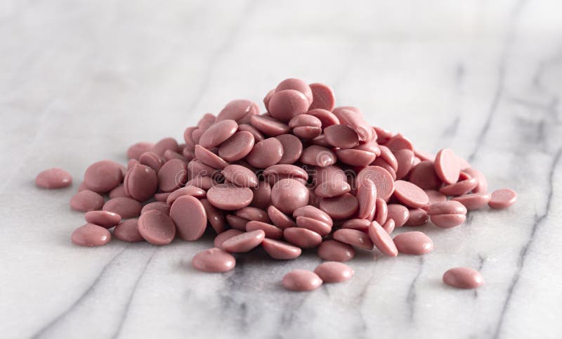 Pile of Authentic Ruby Chocolate Drops on a Marble Counter Stock Image - Image of cherry, ruby ...