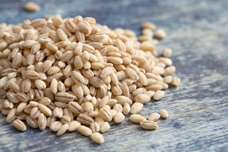 Pile of Barley Wheat on a Rustic Blue Table Stock Image - Image of ...