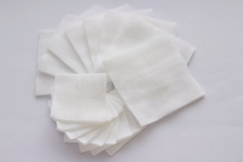 Pile of Big and Small Size Pad Gauzes on White Background in Fan Shape ...