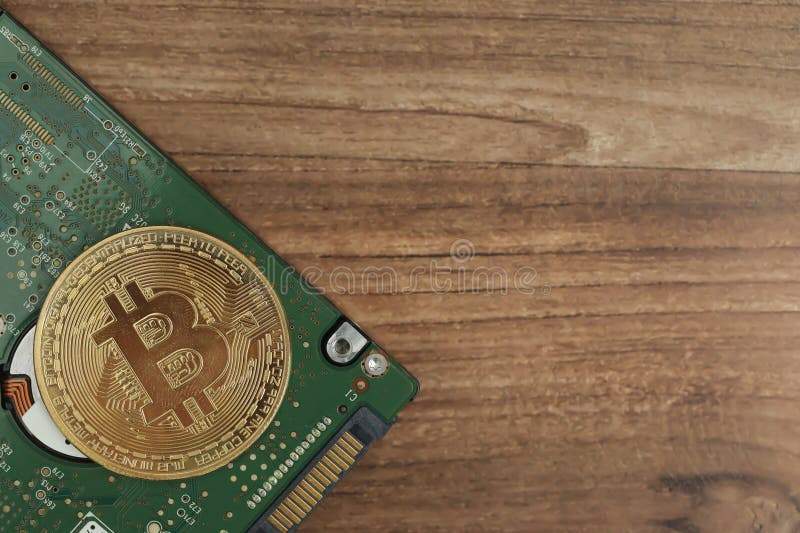 A Pile of Bitcoin Placing Above the Hard Disk. Cryptocurrency Trading ...