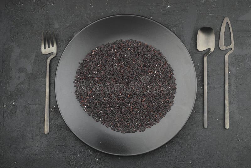 Pile of Black Rice in a Wooden Bowl on a Wooden Table Close-up Stock ...