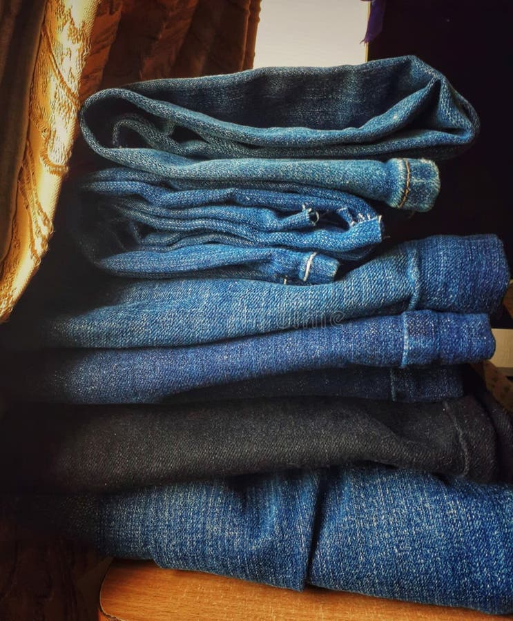 A pile of blue denim jeans stock image. Image of denim - 198406271