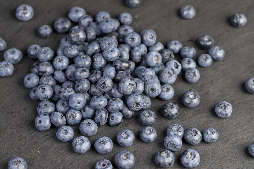 A Pile of Blueberries Scattered on the Board Stock Image - Image of ...