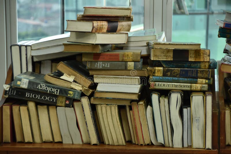 A Pile of Books in the Library Editorial Photography - Image of pile ...