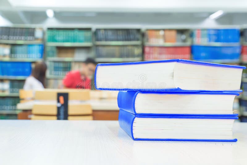 A Pile of Books with Library on the Back Stock Image - Image of pile ...