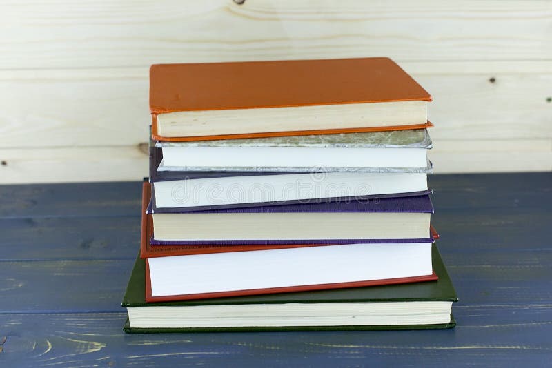 A Pile of Books with Library on the Back Stock Image - Image of open ...