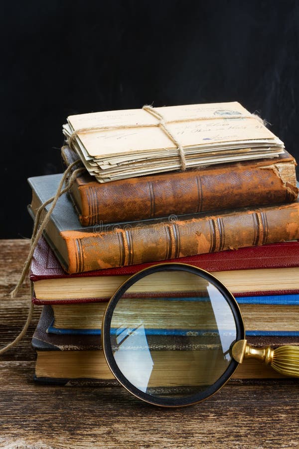 Pile of Books with Looking Glass Stock Photo - Image of read, concept ...