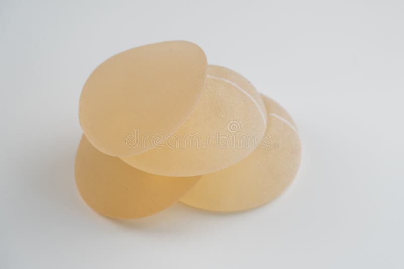 A Pile of Breast Implants on a White Background. Stock Image - Image of ...