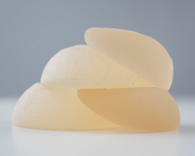 A Pile of Breast Implants on a White Background. Stock Photo - Image of ...