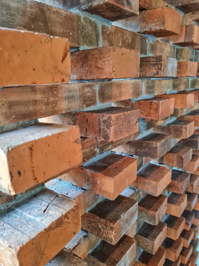 A Pile of Bricks Arranged To Form a Pattern As a Wall Decoration. Stock ...