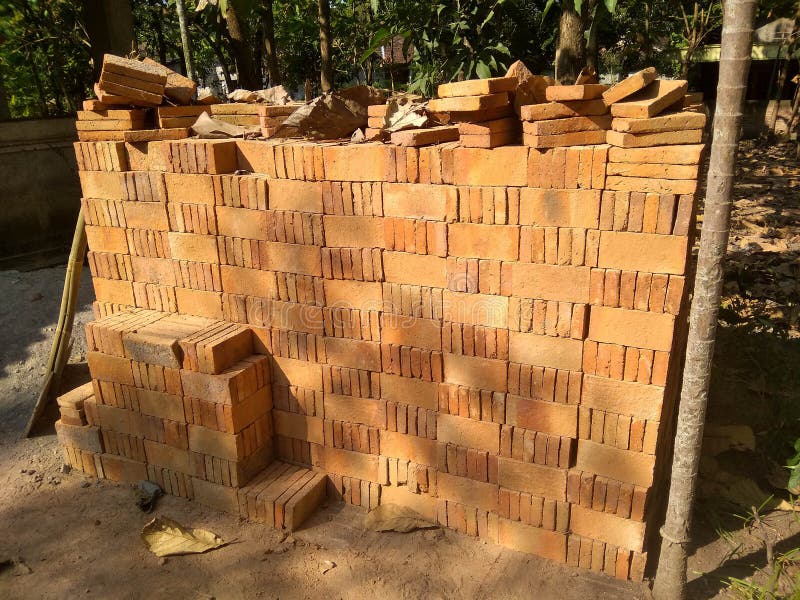 Pile of Bricks Arranged Neatly on Ground at Yard Stock Image - Image of ...