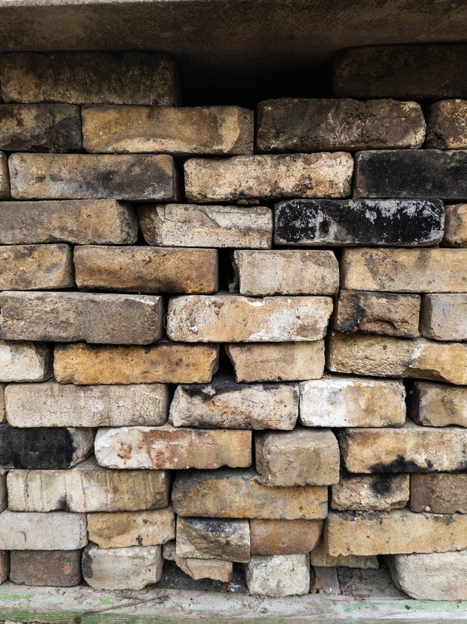A Pile of Bricks Stacked on Top of Each Other Stock Photo - Image of ...