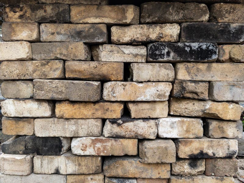 A Pile of Bricks Stacked on Top of Each Other Stock Photo - Image of ...