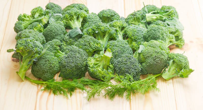 Pile of Broccoli and Branches Dill on a Wooden Surface Stock Image ...