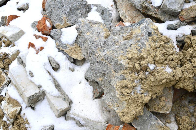 A Pile of Broken Concrete Rubble Covered with Snow Stock Photo - Image ...
