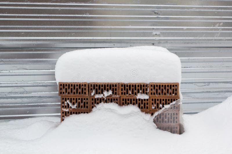 Pile of Building Bricks in the Winter Under the Snow Stock Photo ...