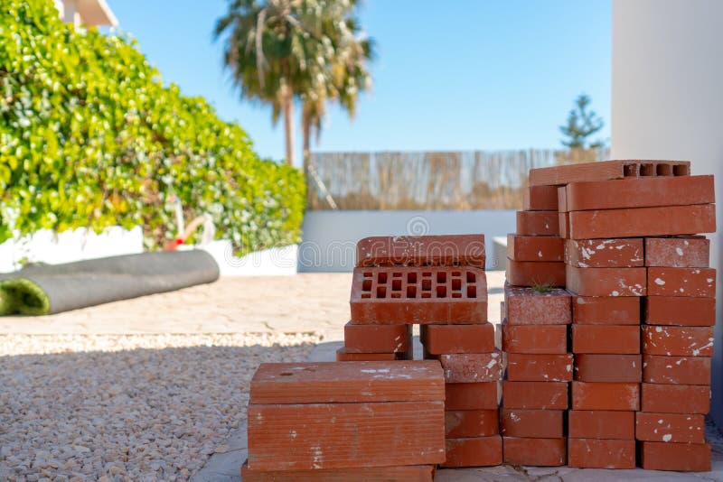 A Pile of Building Materials, Stack of New Red Bricks for Construction ...