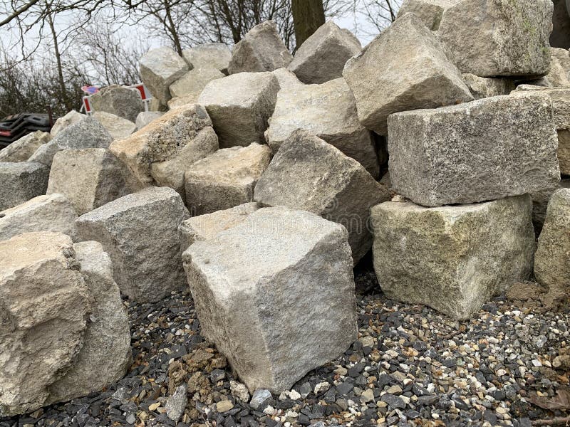 A Pile of Building Stones on a Construction Site. Paving Stones Stock ...