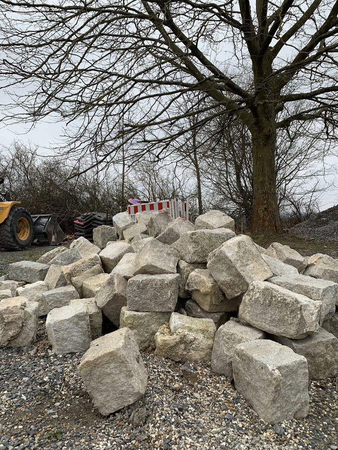 A Pile of Building Stones on a Construction Site. Paving Stones Stock ...