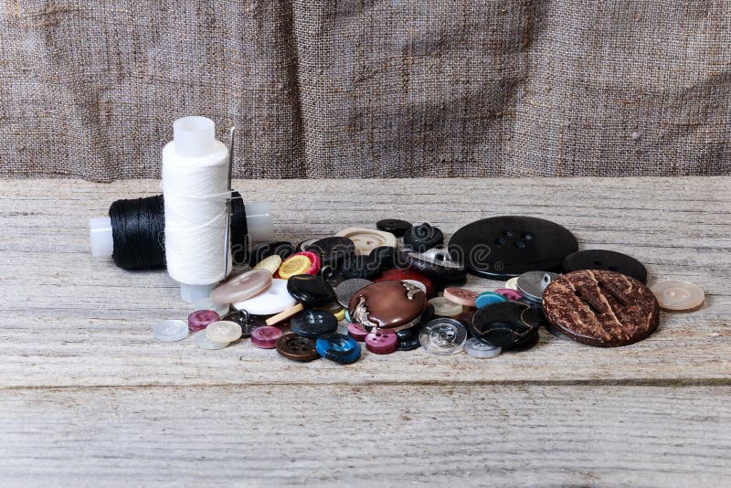 Pile of Buttons, Black and White Thread, Needle Stock Photo - Image of ...