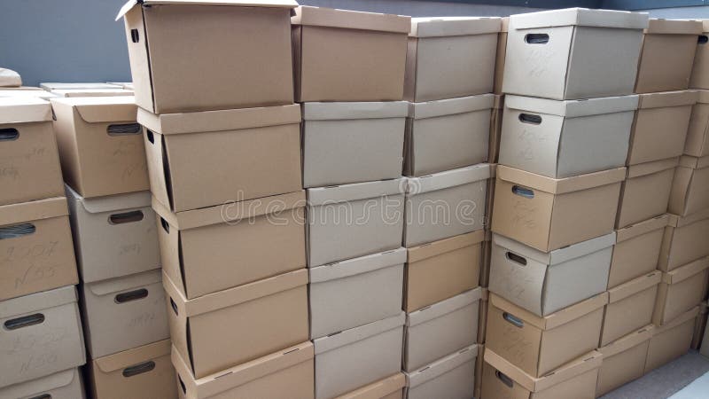 Pile of Cardboard Boxes on the Ground. Stack of Carton Boxes for Office ...