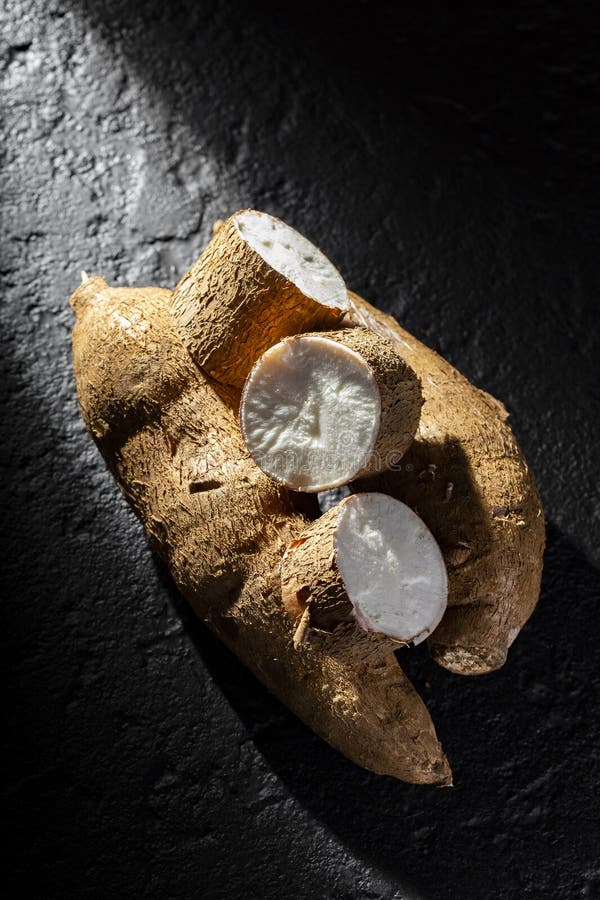 Cassava Root Pile, on a Background of Gray and White Texture (Manihot ...