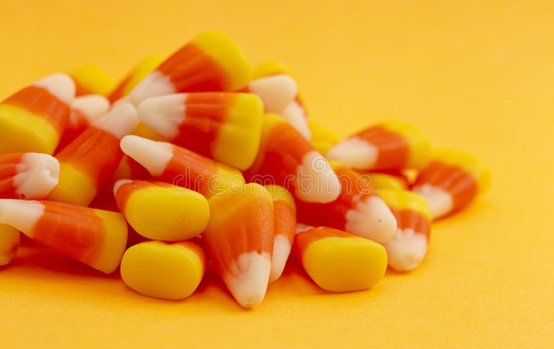 A Pile of Classic Candy Corn on Yellow Orange Background Stock Photo ...