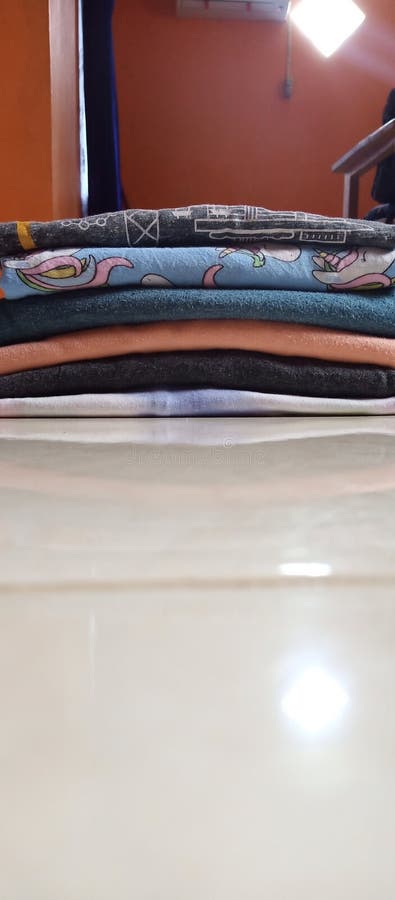 Pile of Clothes on the White Floor Stock Photo - Image of white, floor ...