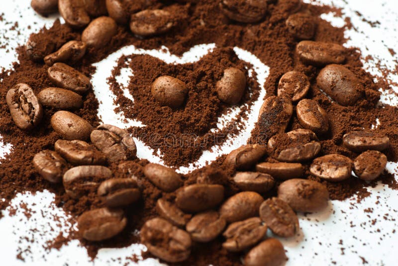 Pile of Coffee Beans and Coffee Powder with Shape of Heart and Face ...