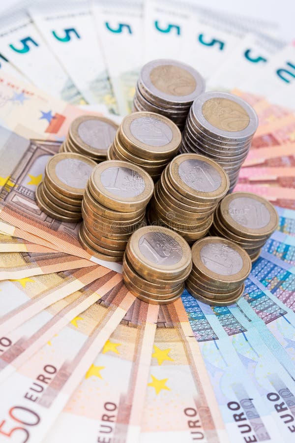 A Pile of Coins on Bank Notes Stock Photo - Image of savings, paper ...