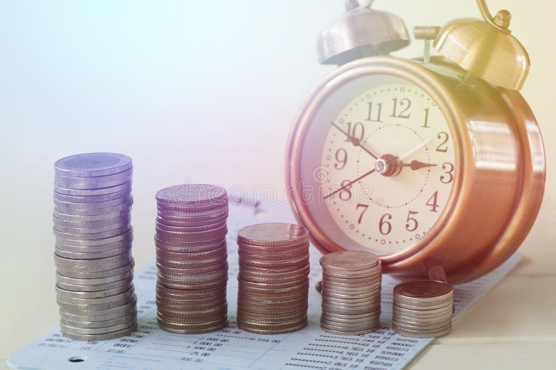 Pile of coins with clock o stock photo. Image of rich - 84971640