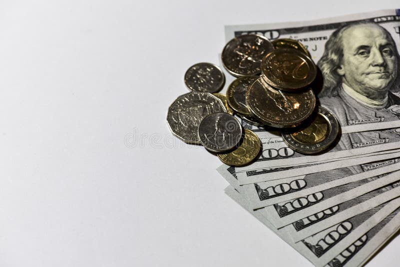 A Pile of Coins and a Stack of Dollar Bills Stock Image - Image of ...