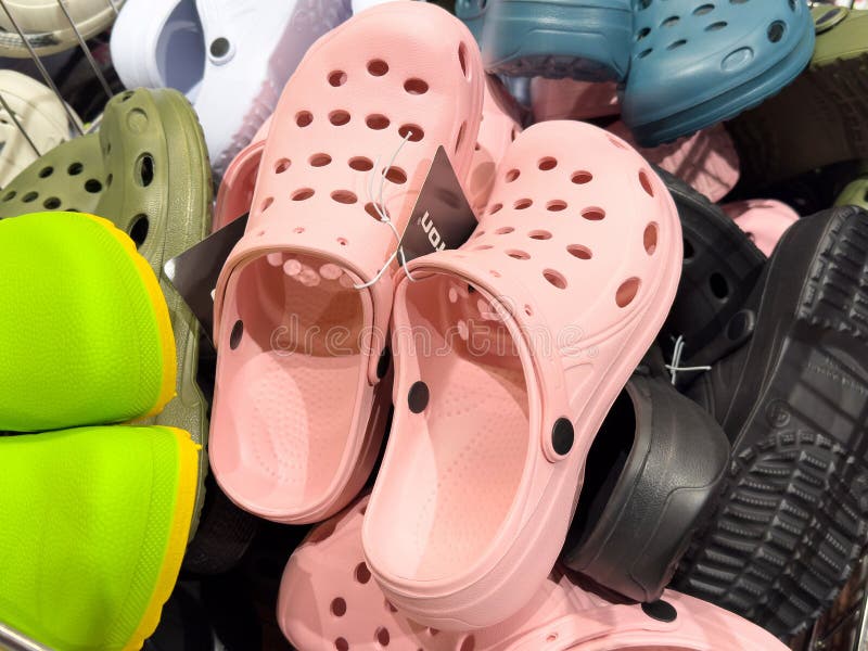 Pile of Colorful Clogs Featuring Prominent Pink Pair in Center ...